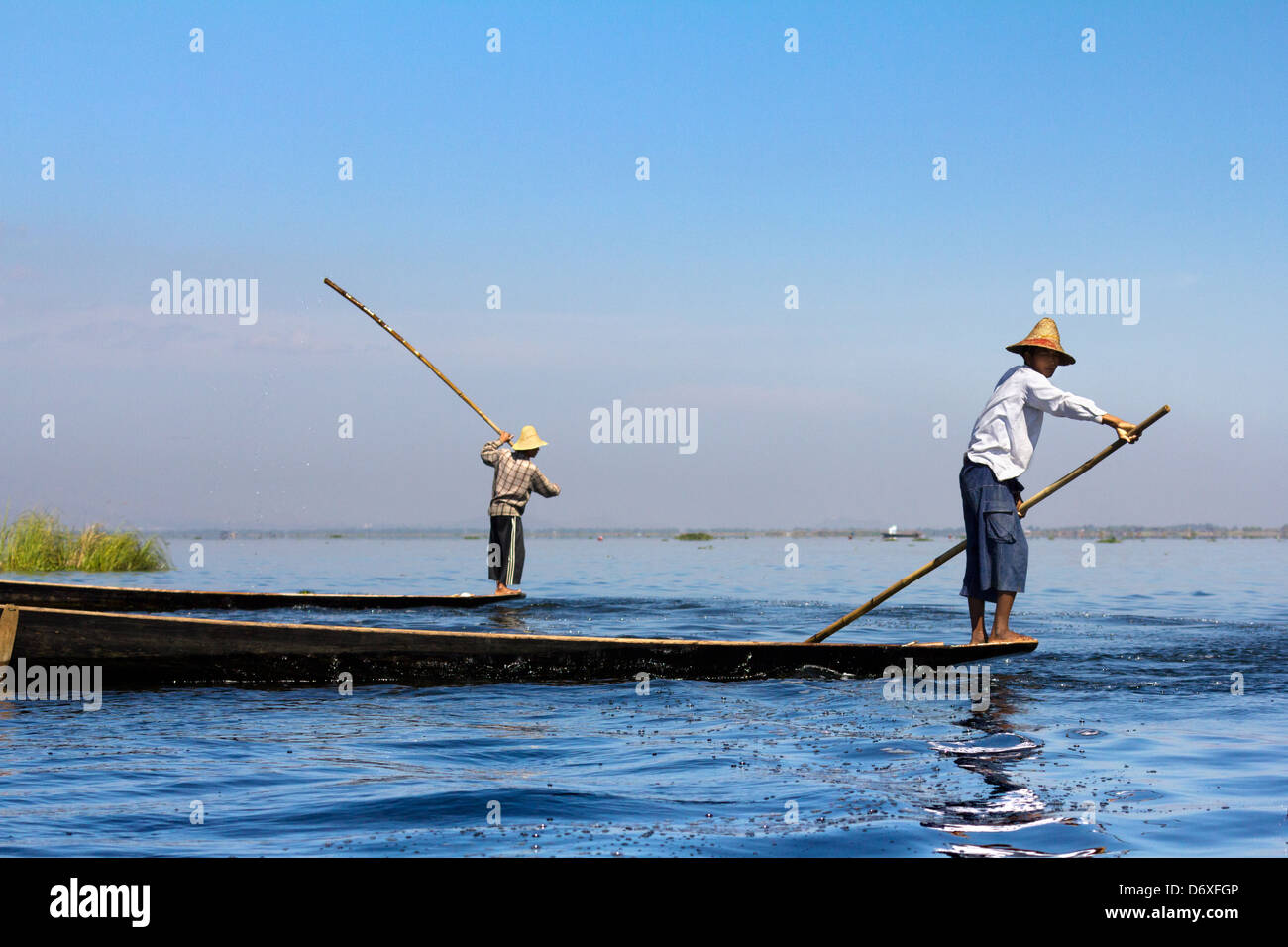Fisherman beating the water to attract fish on Lake Inle, Myanmar 4 ...
