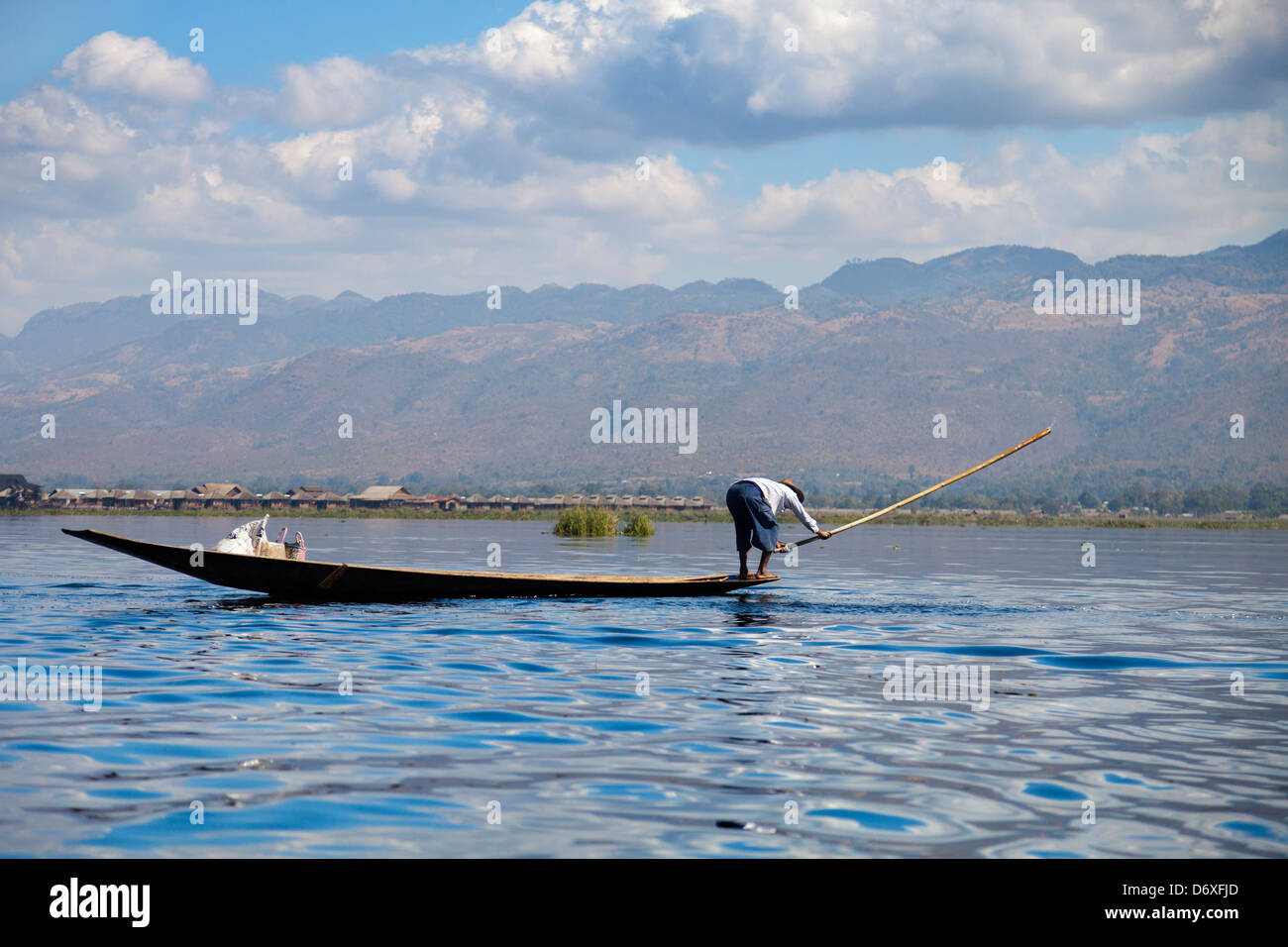 Fisherman beating the water to attract fish on Lake Inle, Myanmar 3 ...
