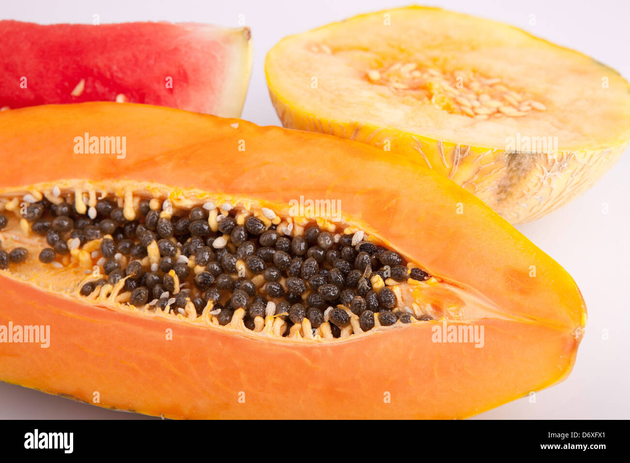 Papaya, melon and watermelon slices isolated over white Stock Photo - Alamy