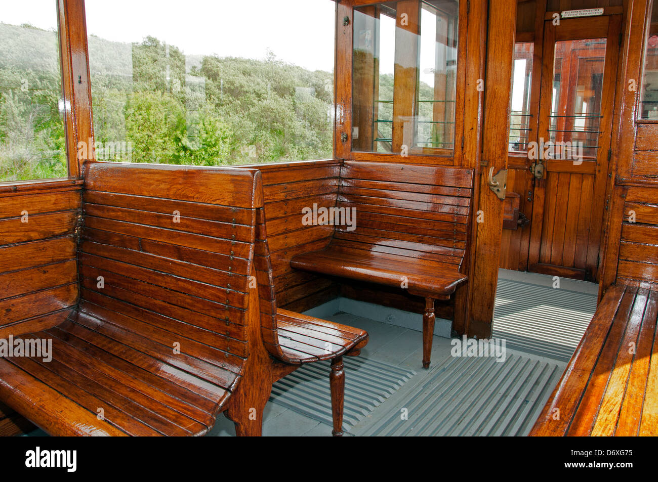 old wooden train interior with view trought the windows Stock Photo - Alamy