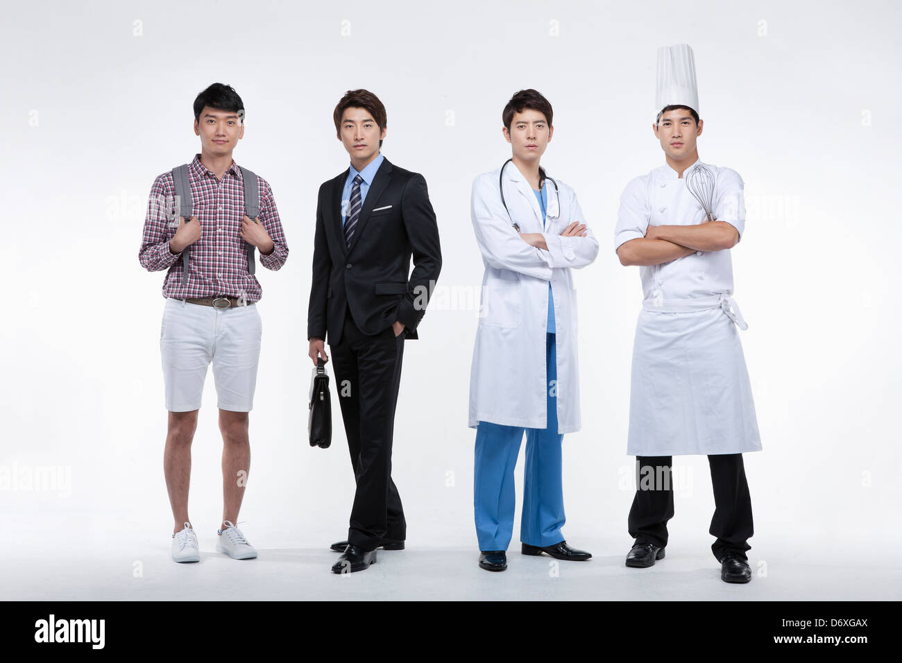Four standing men hi-res stock photography and images - Alamy