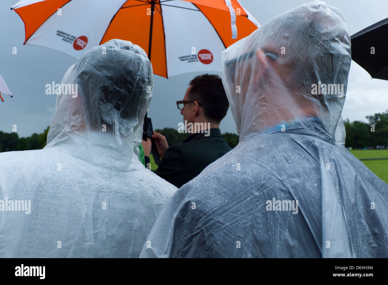 Spectators in rain, polo match Stock Photo - Alamy