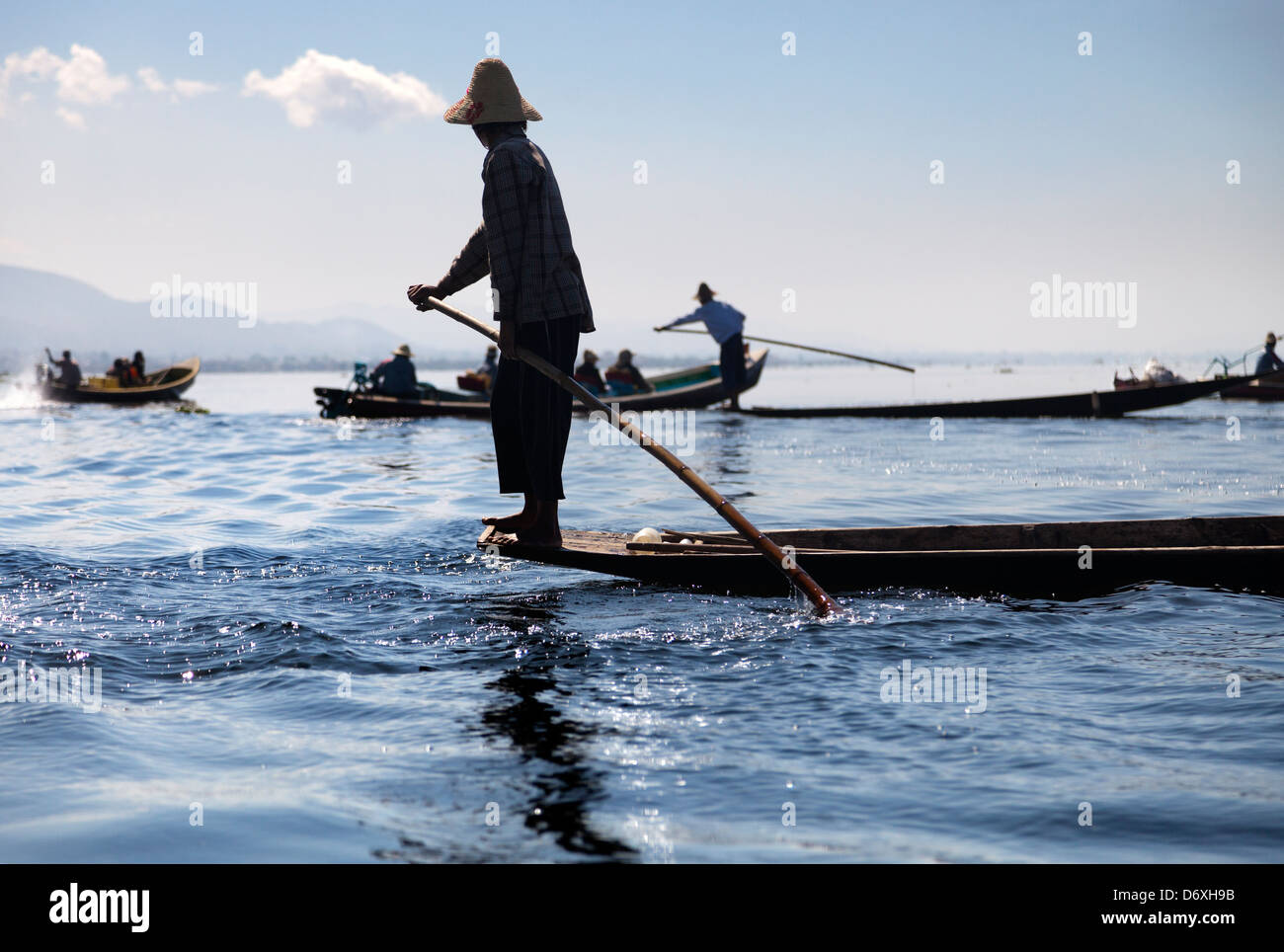 Fishing boats in a line on Lake Inle, Myanmar Stock Photo - Alamy