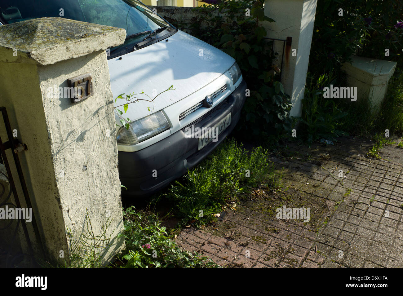 Front of van parked on narrow overgrown path Stock Photo - Alamy
