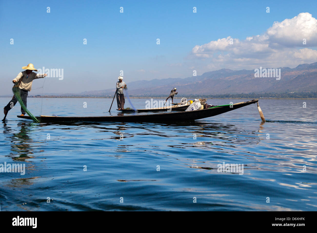 Three fishing boats in a line on Lake Inle, Myanmar 2 Stock Photo - Alamy