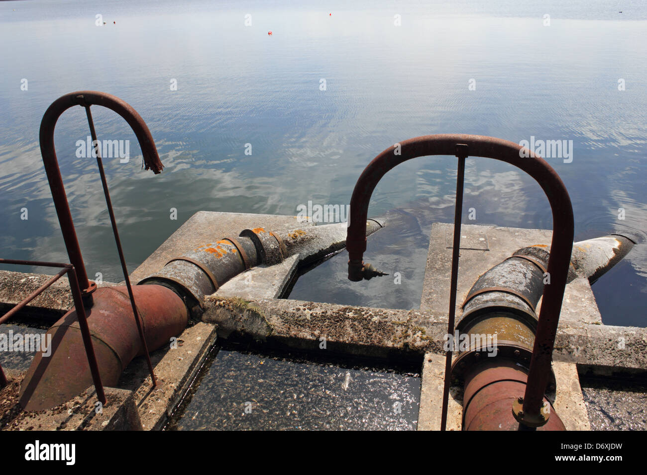 Old rusty outlet pipes at Island Barn Reservoir, West Molesey, Surrey ...
