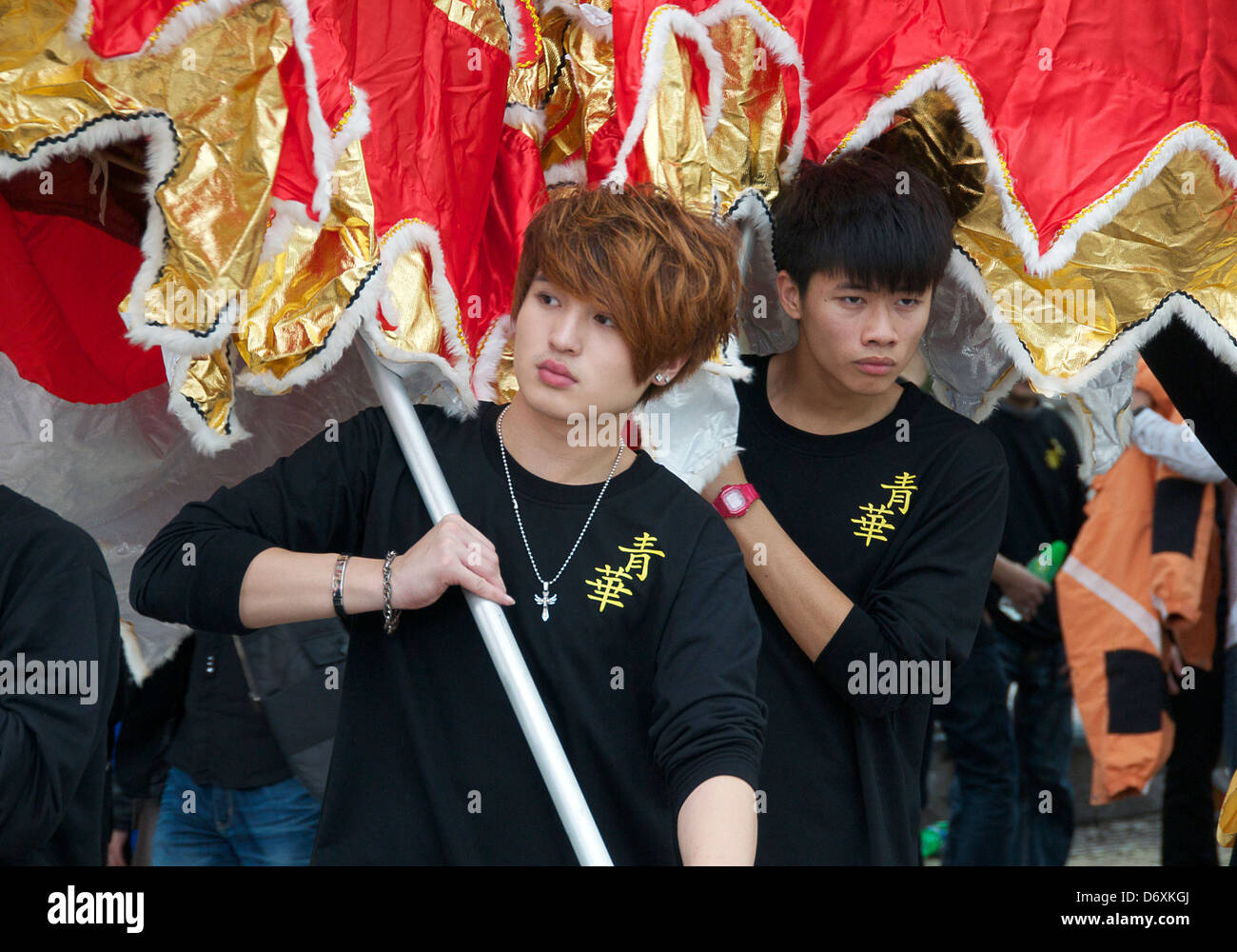 Two young people in dragon parade A Ma Temple Macau Stock Photo - Alamy