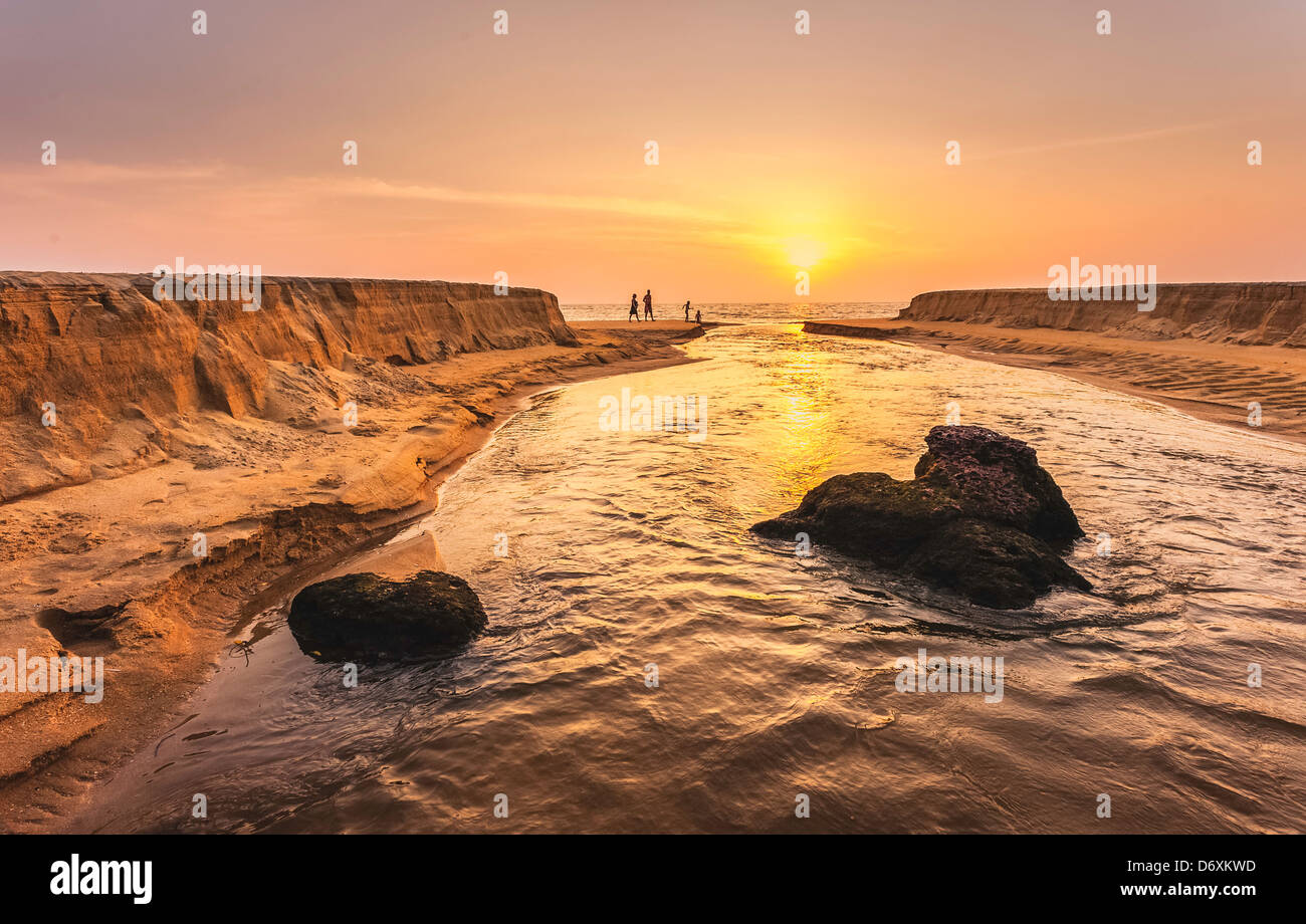 Thottada river empties into Arabian Sea along Thottada beach on a fine ...