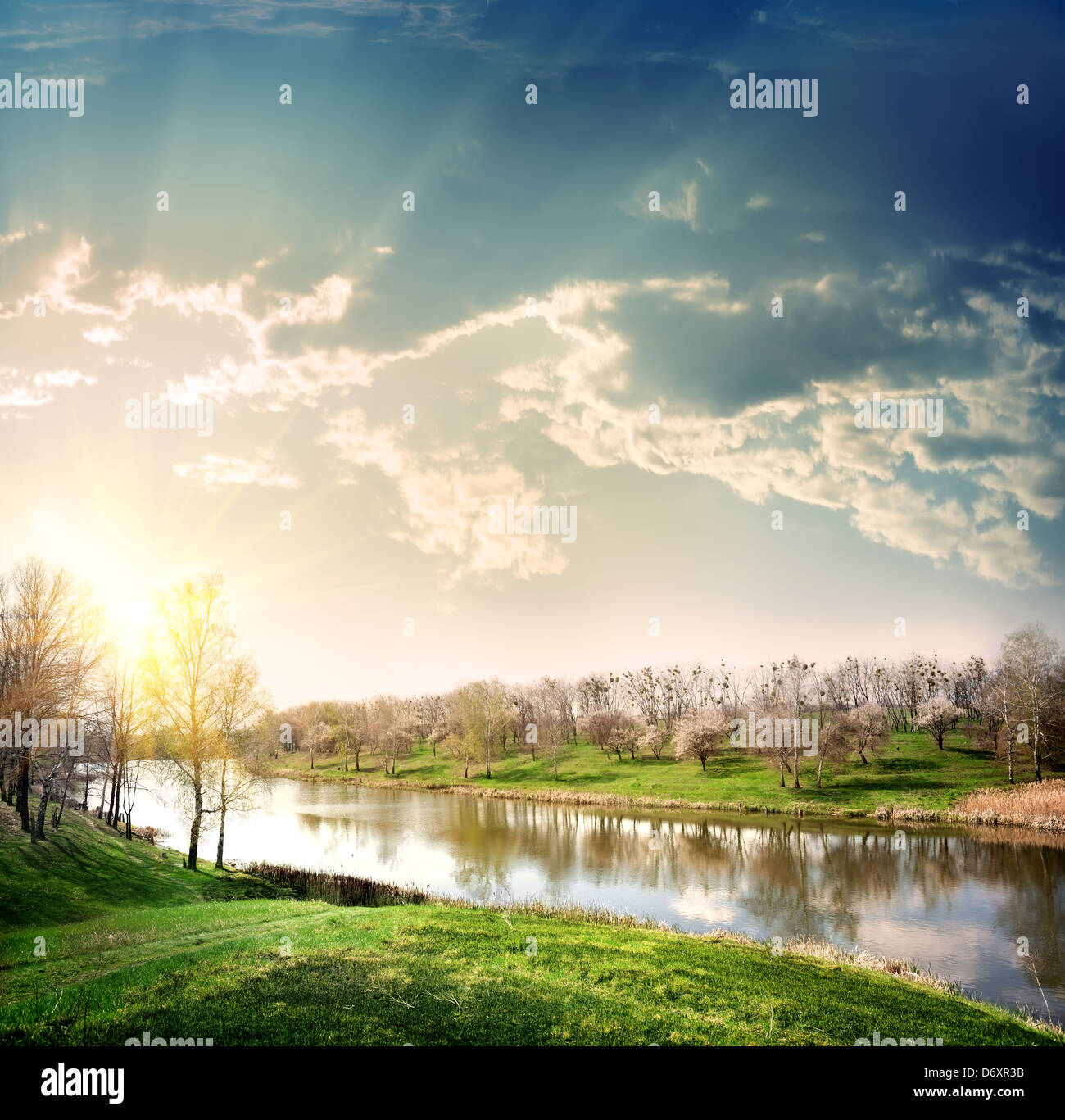 Spring landscape with the river and the sun Stock Photo - Alamy