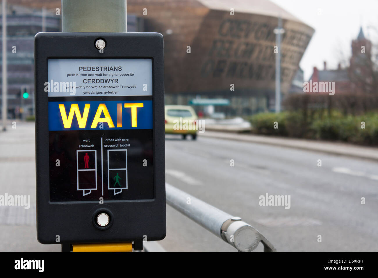 Pedestrian Wait sign at Pelican crossing in both English and Welsh ...