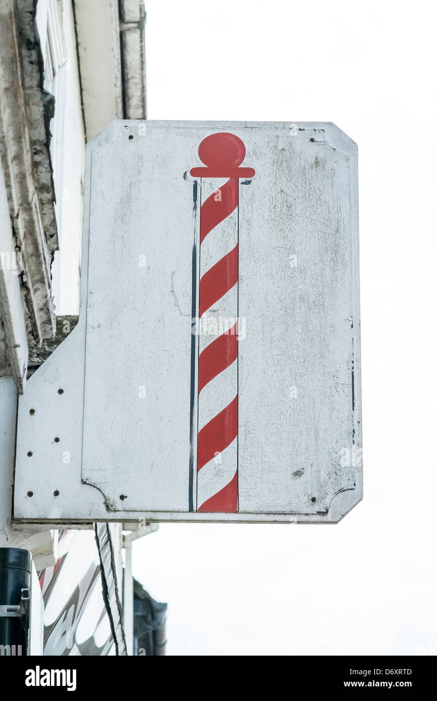 Looking up at a traditional barbers shop salon pole logo sign Stock ...