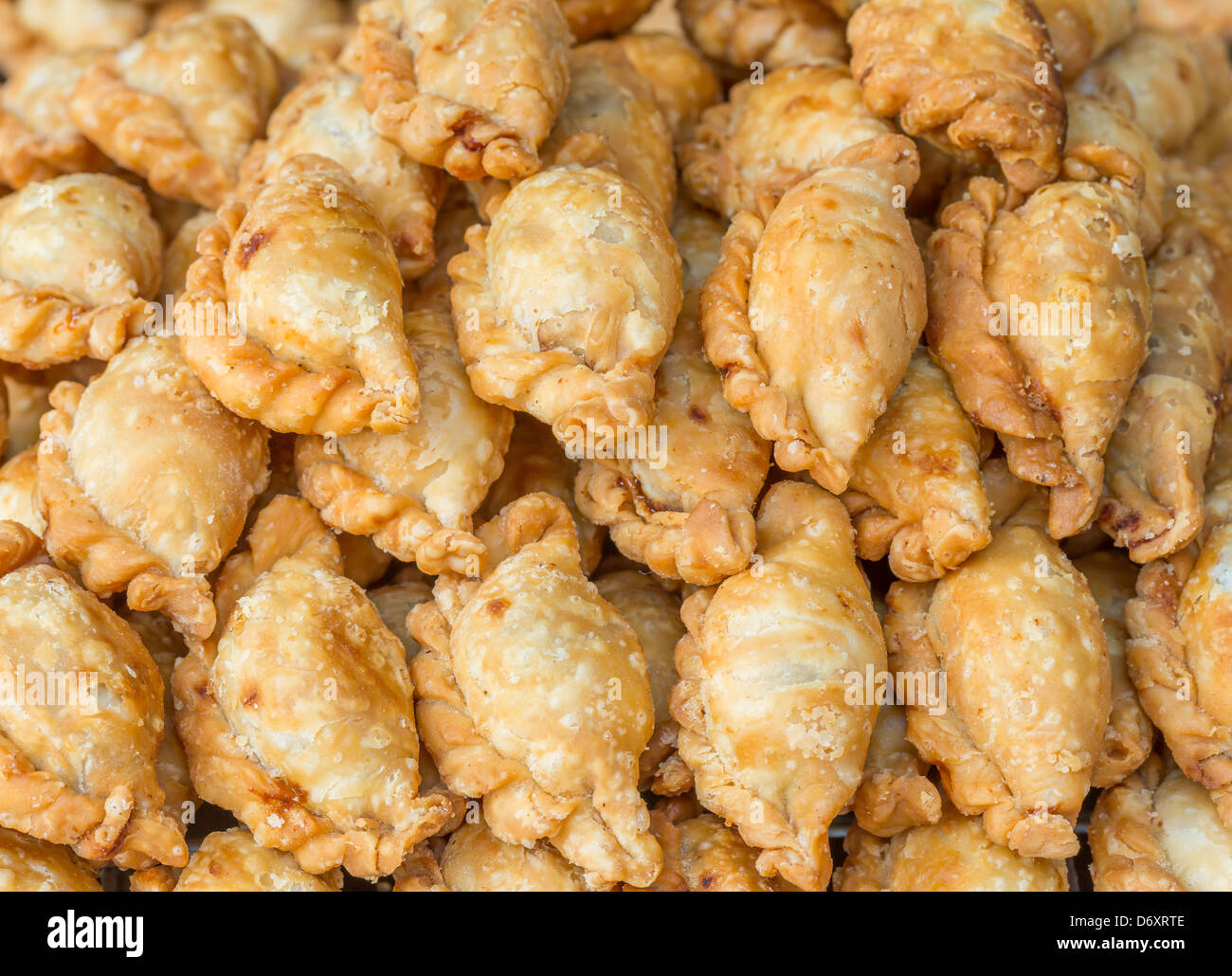 Thai little curry puff sale in market Stock Photo - Alamy