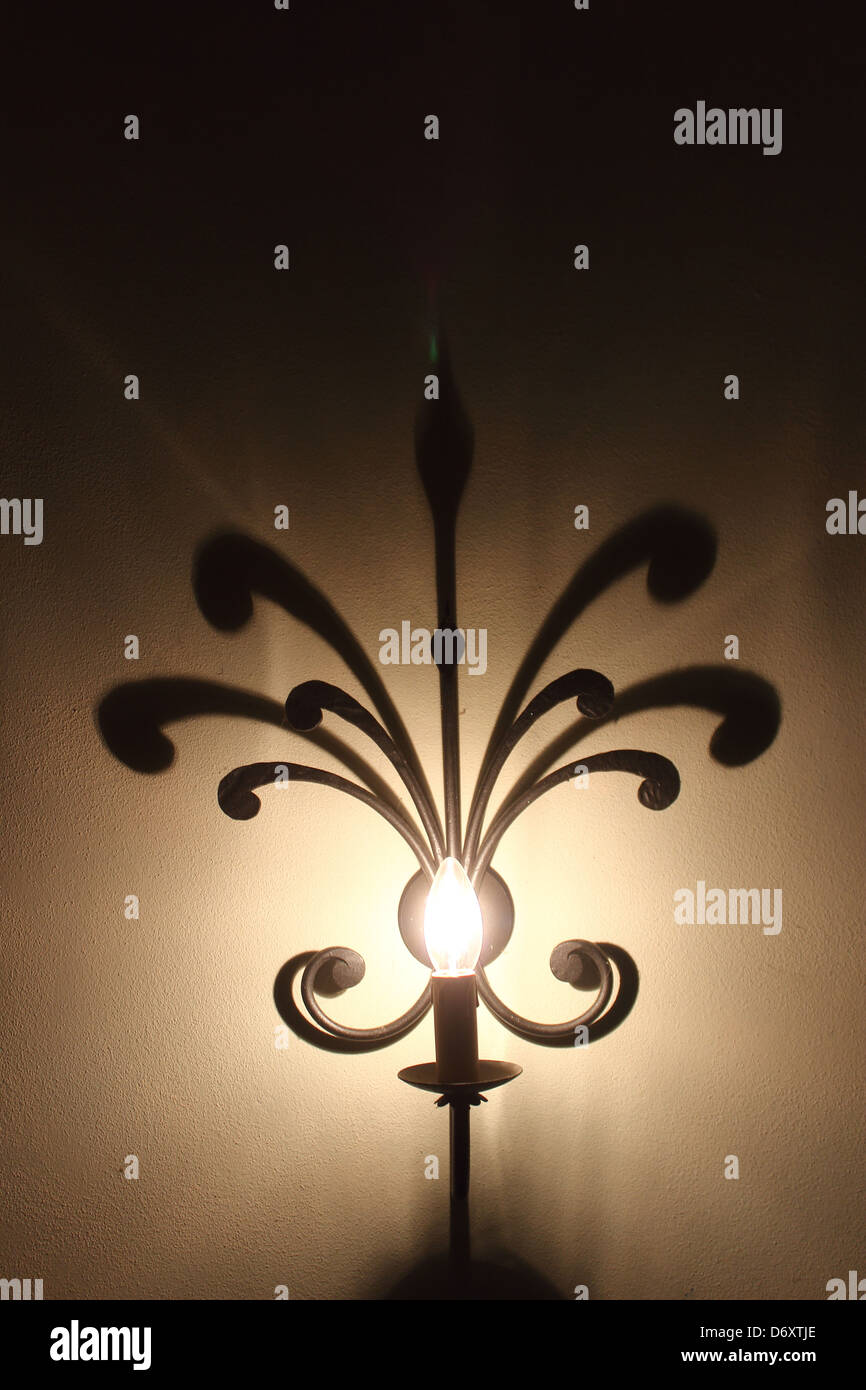 Lamp on the wall (applique) and its shadow like a flower Stock Photo ...