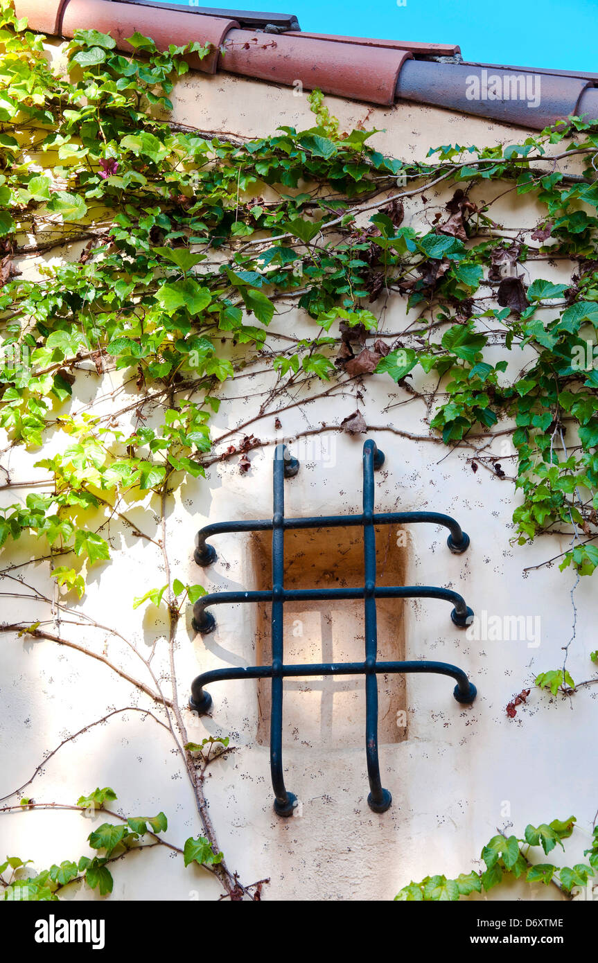 Cute small window with a rack Stock Photo - Alamy