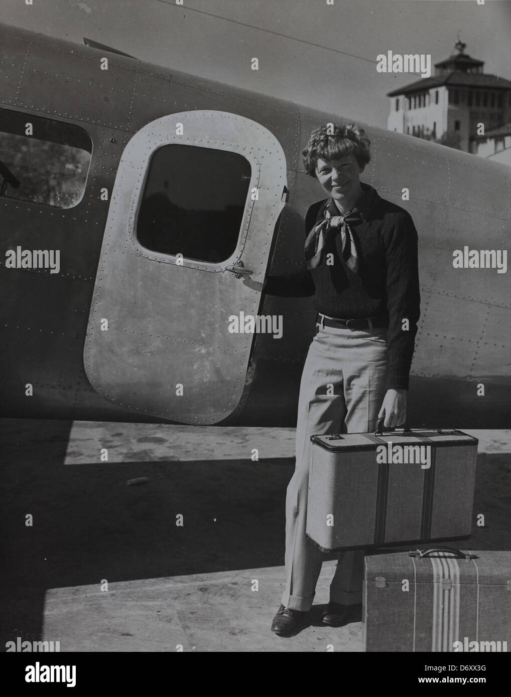 A famous photograph of Amelia Earhart beside her aircraft, taken in ...
