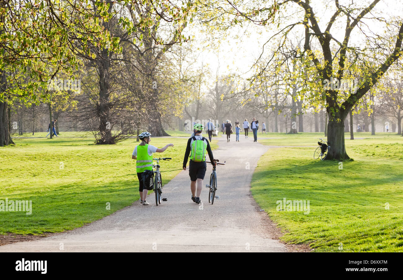 Walking cycling in park hi-res stock photography and images - Alamy