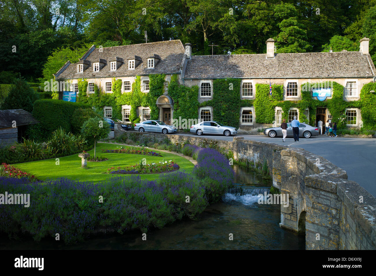 Swan Hotel and River Coln at Bibury in The Cotswolds UK. L to R: Audi ...