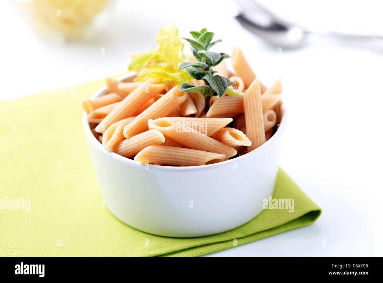 Bowl of whole wheat pasta tubes - closeup Stock Photo - Alamy