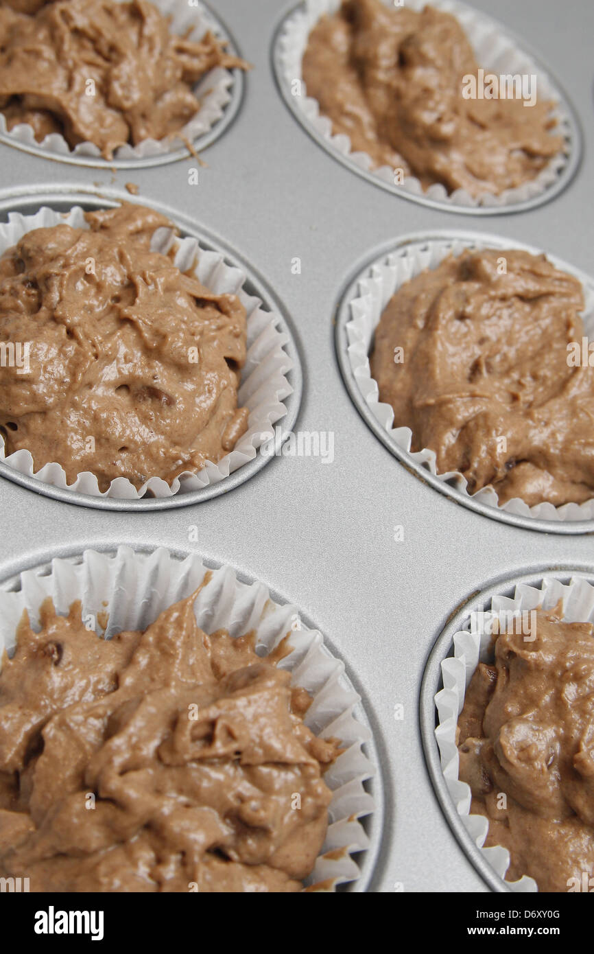 uncooked chocolate & cherry muffins in muffin tray Stock Photo - Alamy