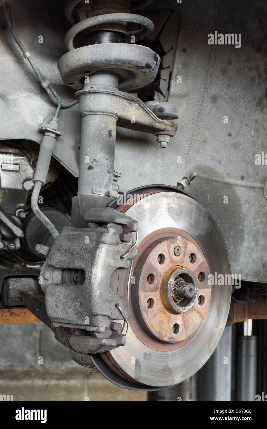 Car disc brake inspection in garage for safety use Stock Photo - Alamy