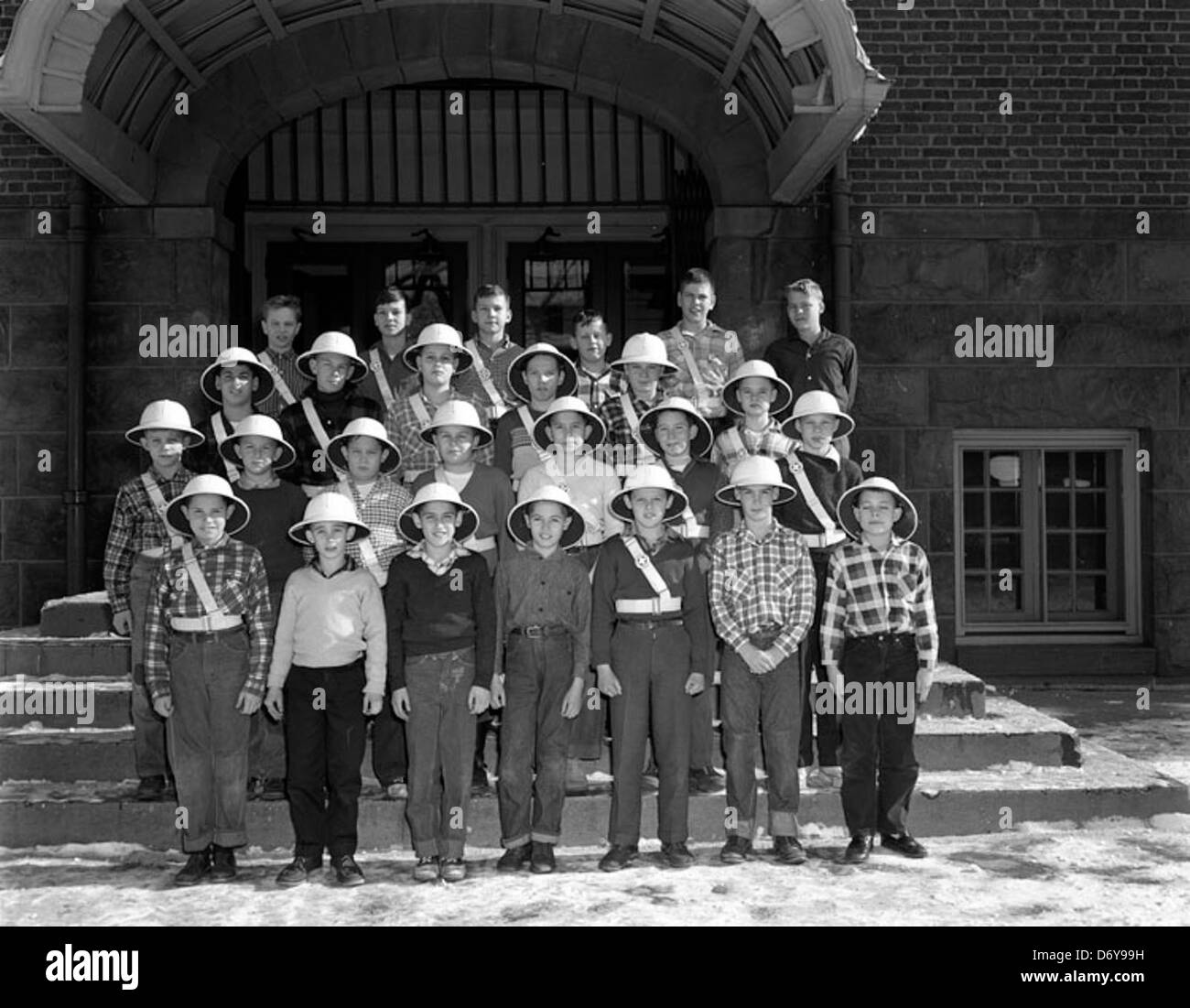This 1957 image shows children participating in the safety patrol ...