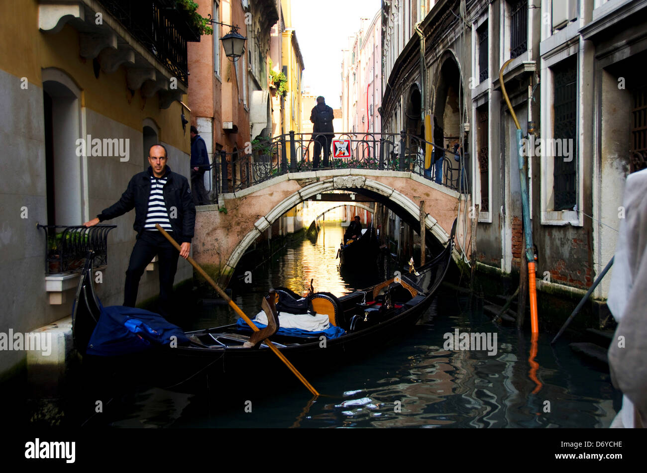 Man rowing a gondola, Grand Canal, Venice, Veneto, Italy Stock Photo ...