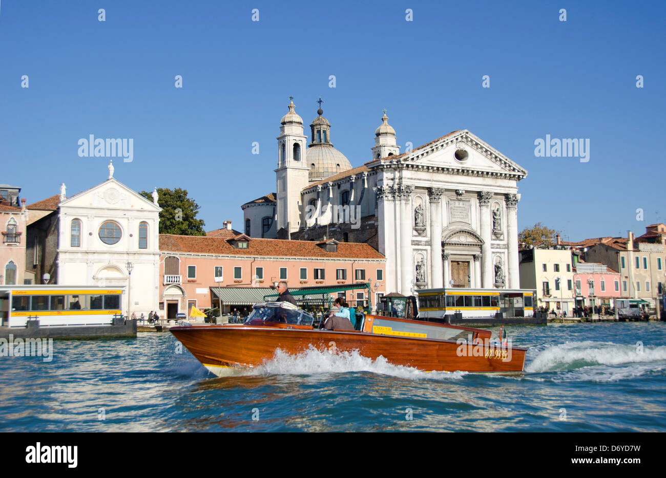 Water taxi moving in a canal with a church in the background, Gesuati ...