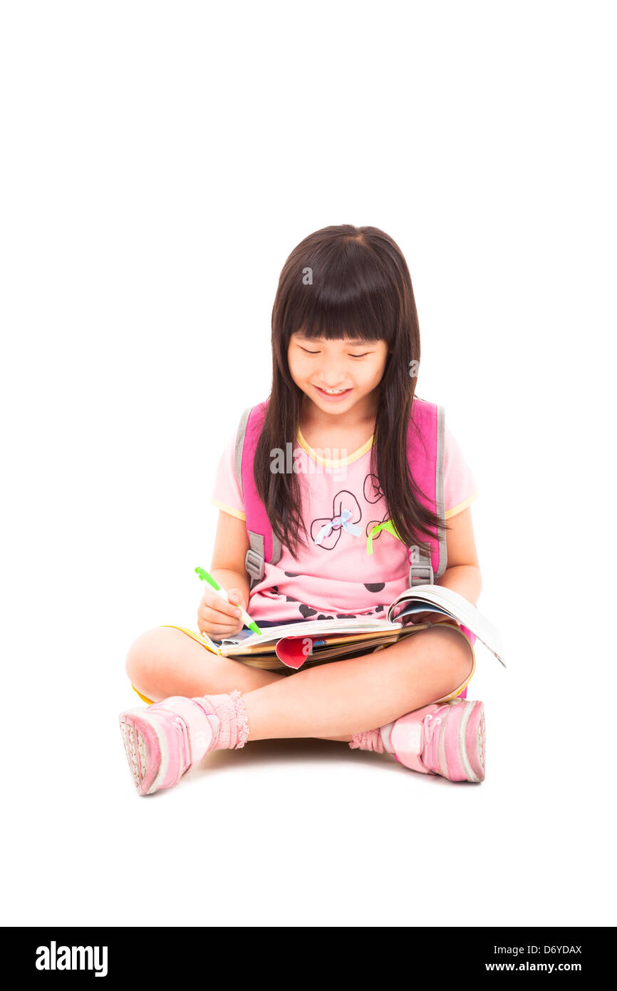 Happy little girl sitting reading hi-res stock photography and images ...