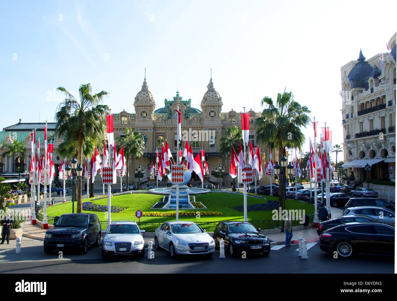 National flags of Monaco in front of a building, Monte Carlo, Monaco ...