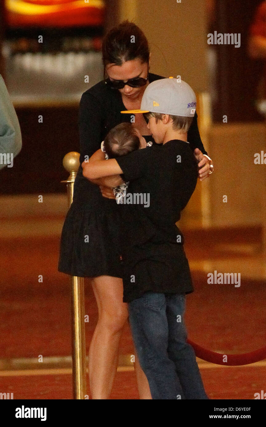 Victoria hands baby Harper Seven to Romeo Victoria Beckham and her four ...