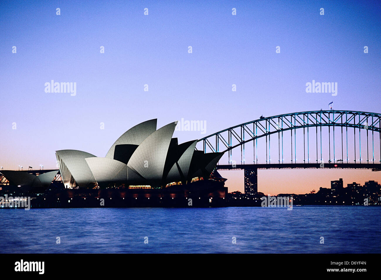 Opera house in front of a bridge, Sydney Opera House, Sydney Harbor ...