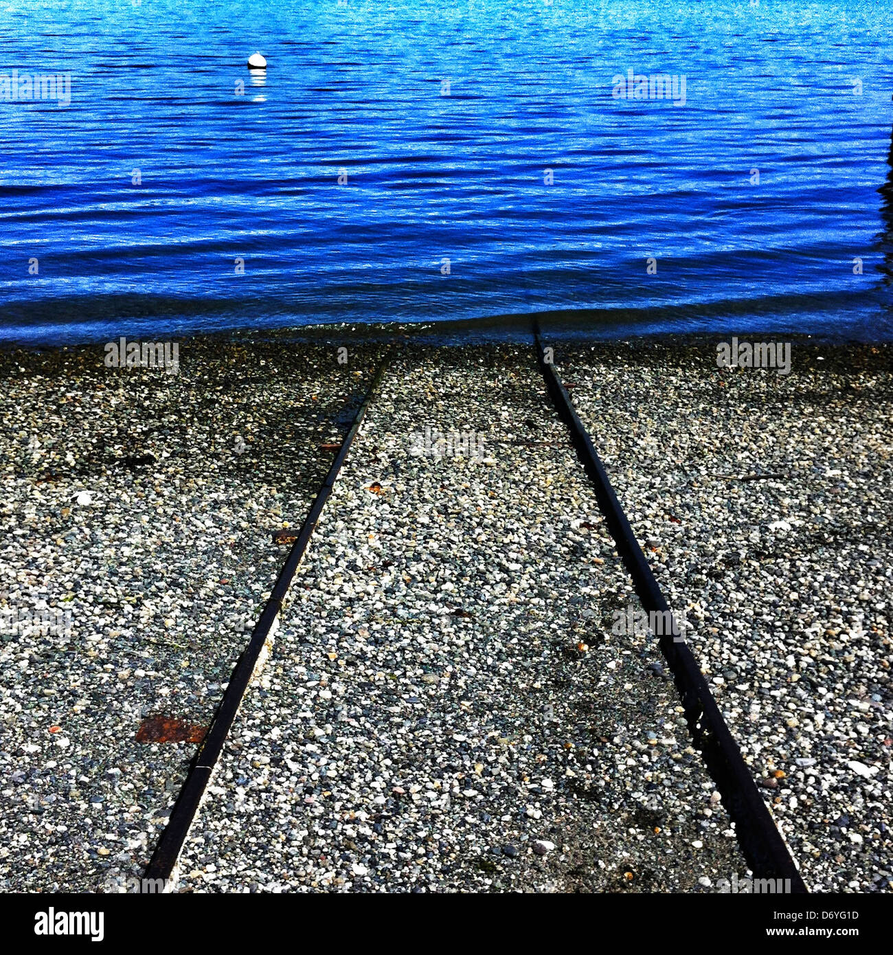 Blue water on boat ramp Stock Photo - Alamy