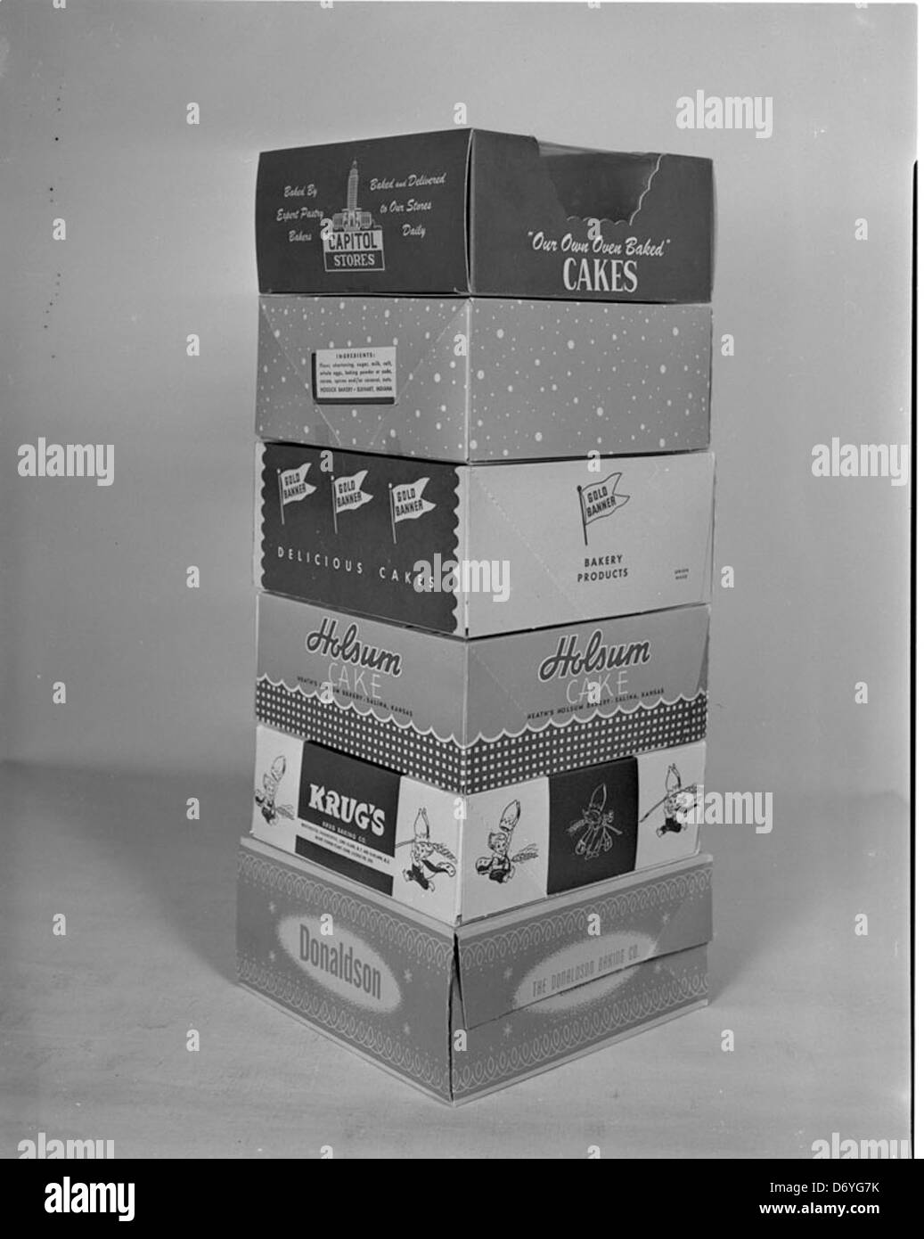 This photograph features a cake box display, captured by Adolph B. Rice ...