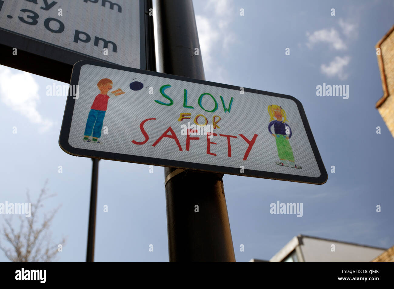 Slow For Safety road sign in residential side street in Islington ...