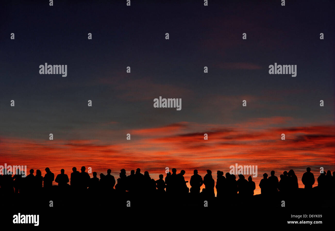 Silhouette of a people looking at a view during sunset Stock Photo - Alamy