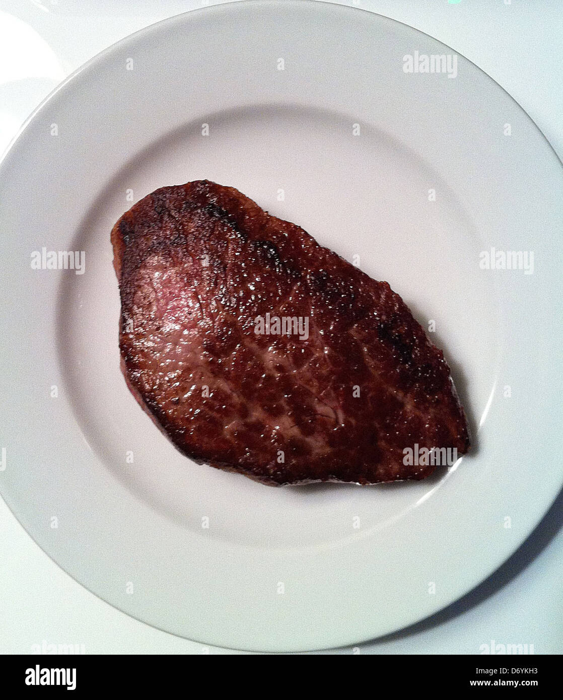 Plate of cooked meat Stock Photo - Alamy