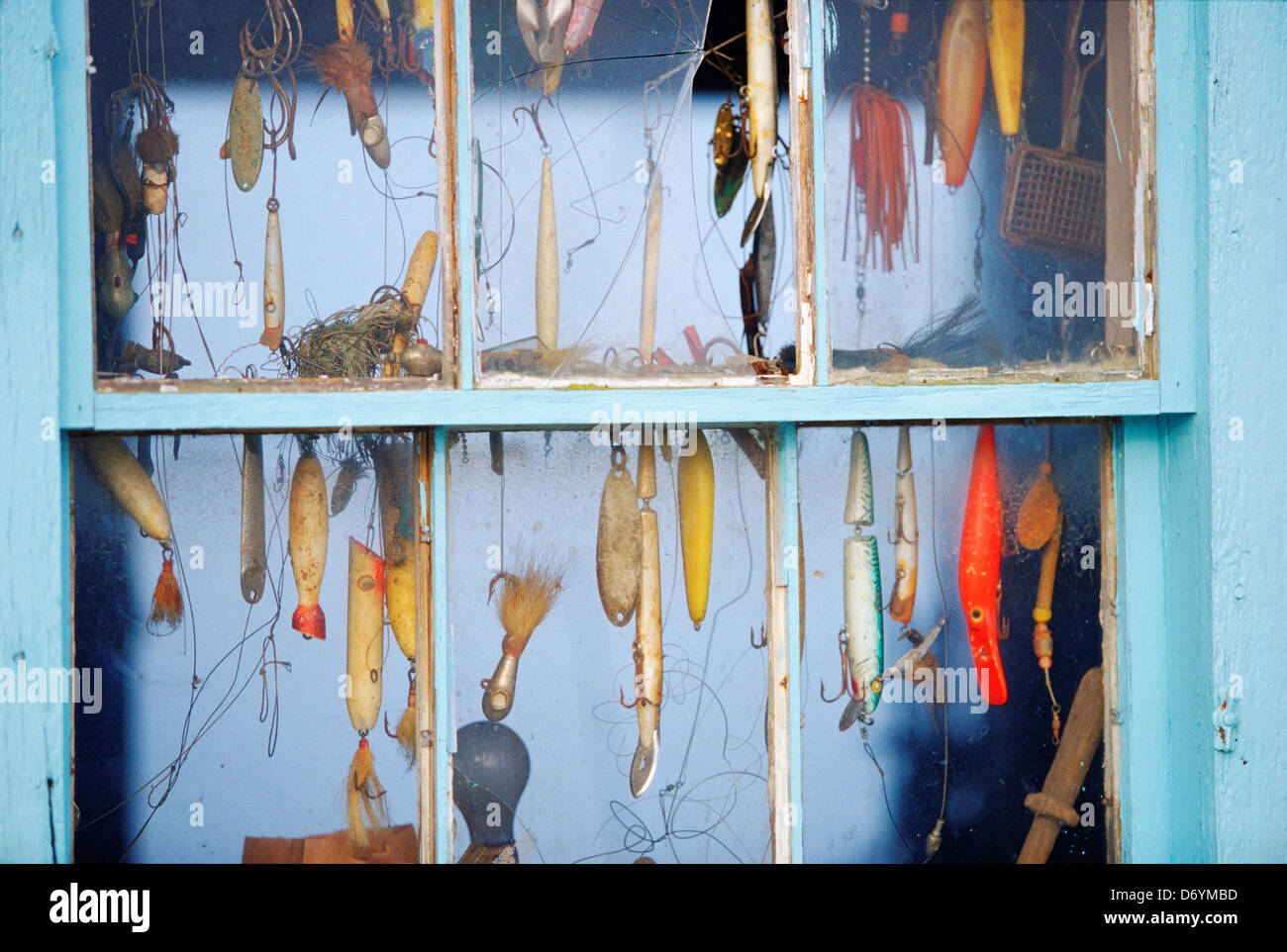 Fishing lures hanging inside a window at Menemsha Harbor, Martha's ...