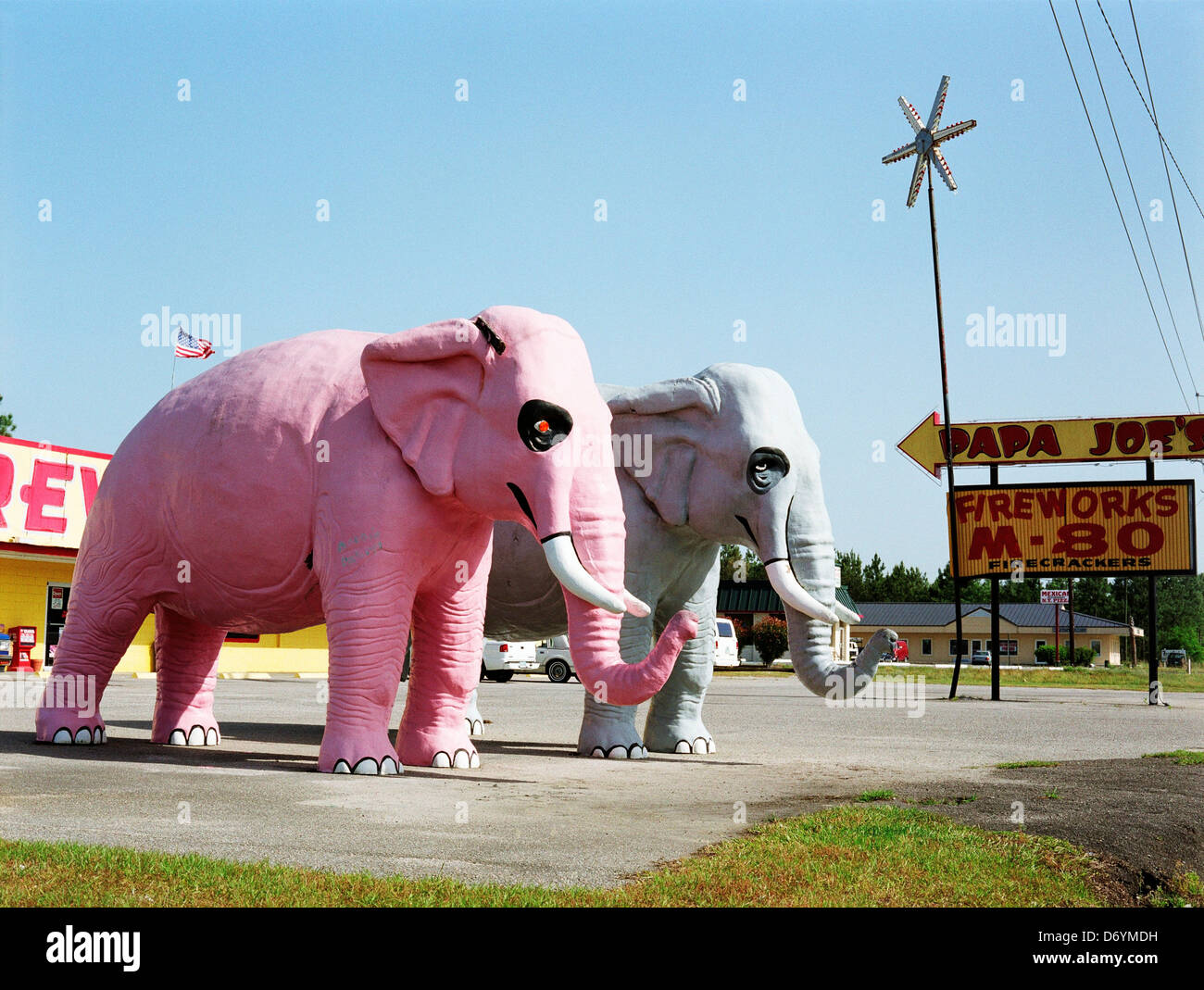 Pink and Gray elephant sculptures standing in front of Papa Joe's ...