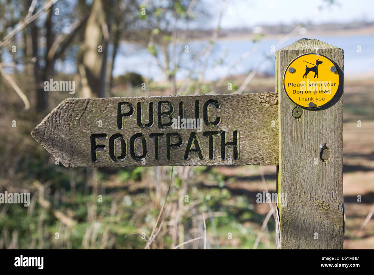 Arrow direction pointer on wooden public footpath sign, Sutton, Suffolk ...