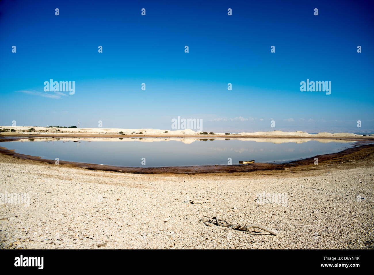 Abandoned - old boat in a deserted water pool next to the dead sea ...