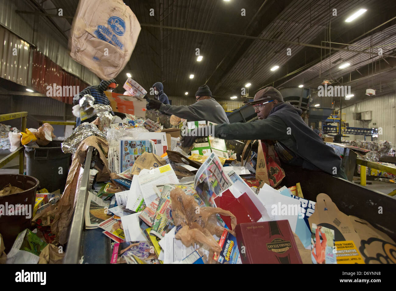Workers sort materials for recycling Stock Photo - Alamy