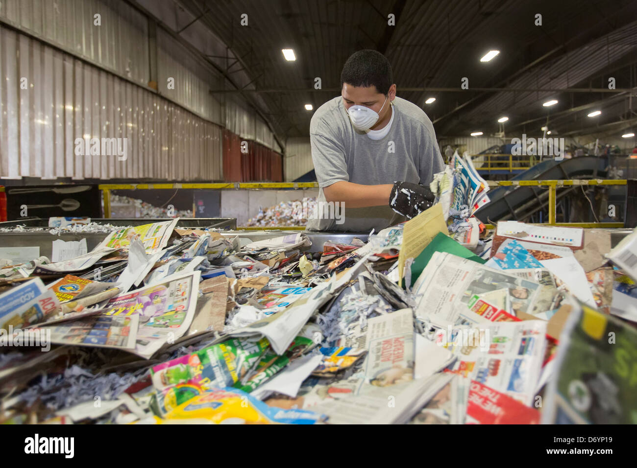 Workers sort materials for recycling Stock Photo - Alamy