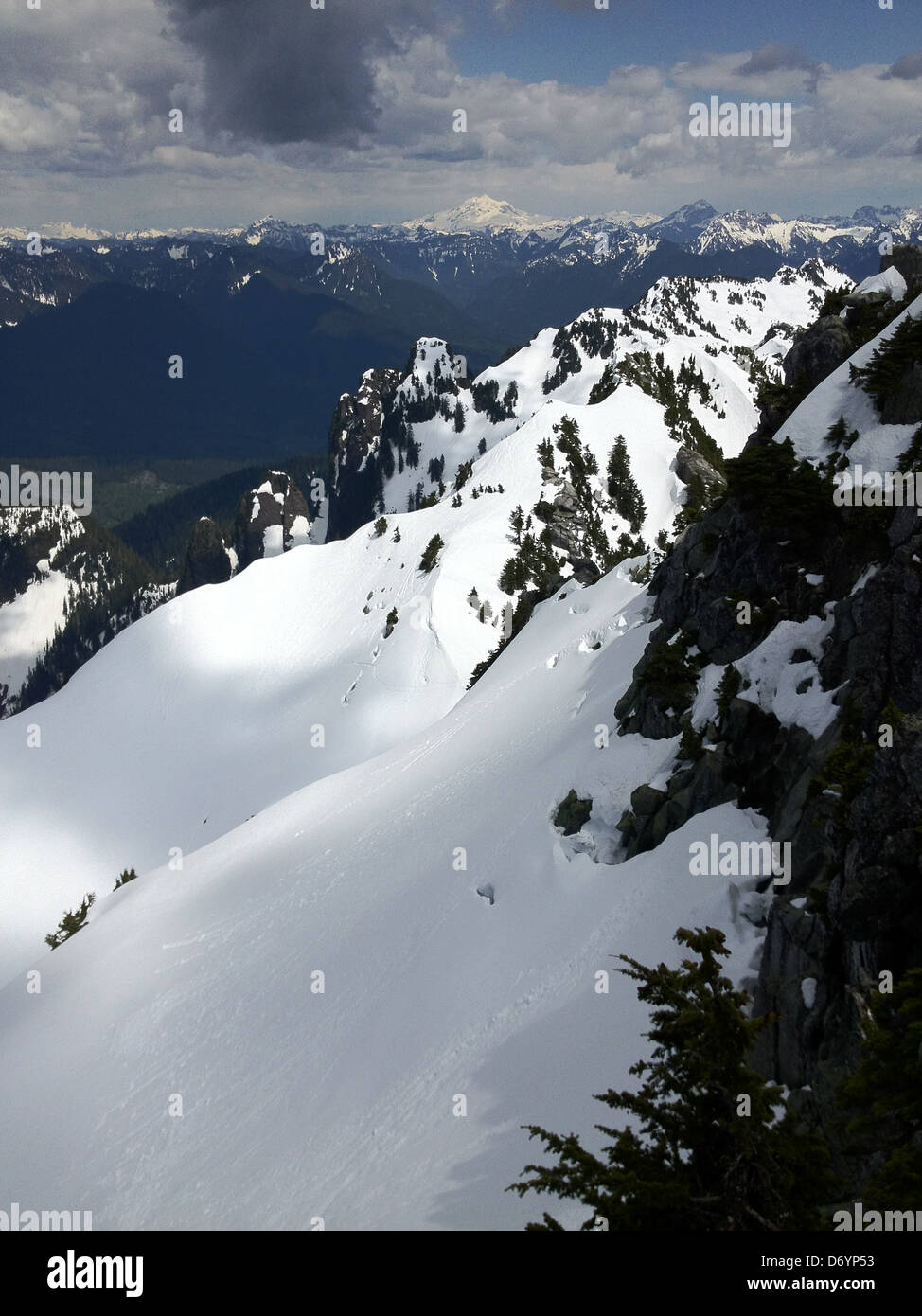 Snowy slopes on rocky mountainside, Seattle, Washington, United States ...