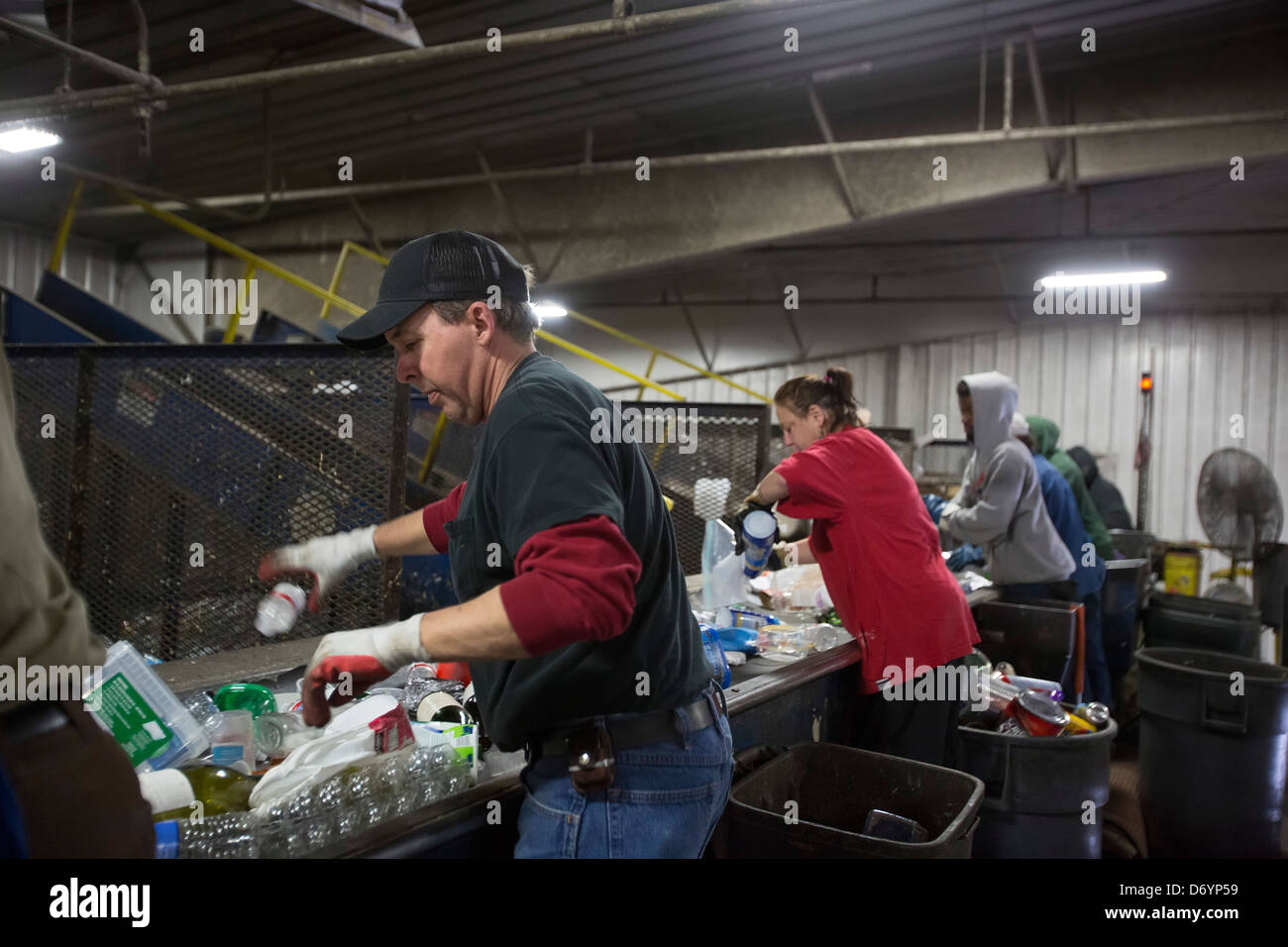 Workers sort materials for recycling Stock Photo - Alamy