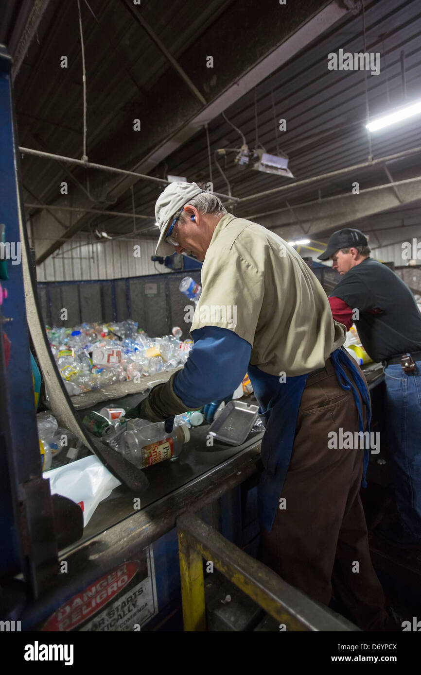 Workers sort materials for recycling Stock Photo - Alamy