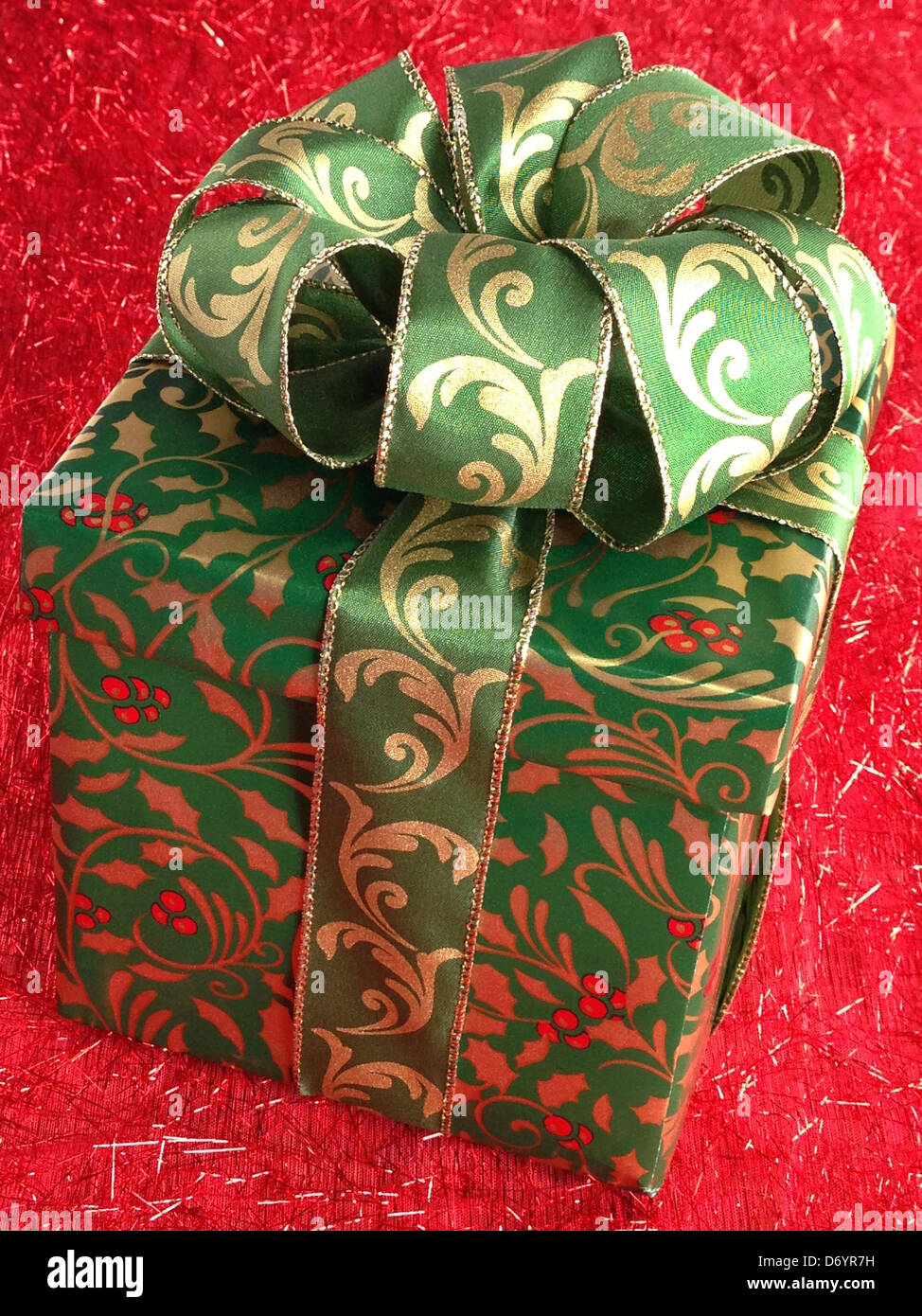 Green and gold Christmas present Stock Photo - Alamy