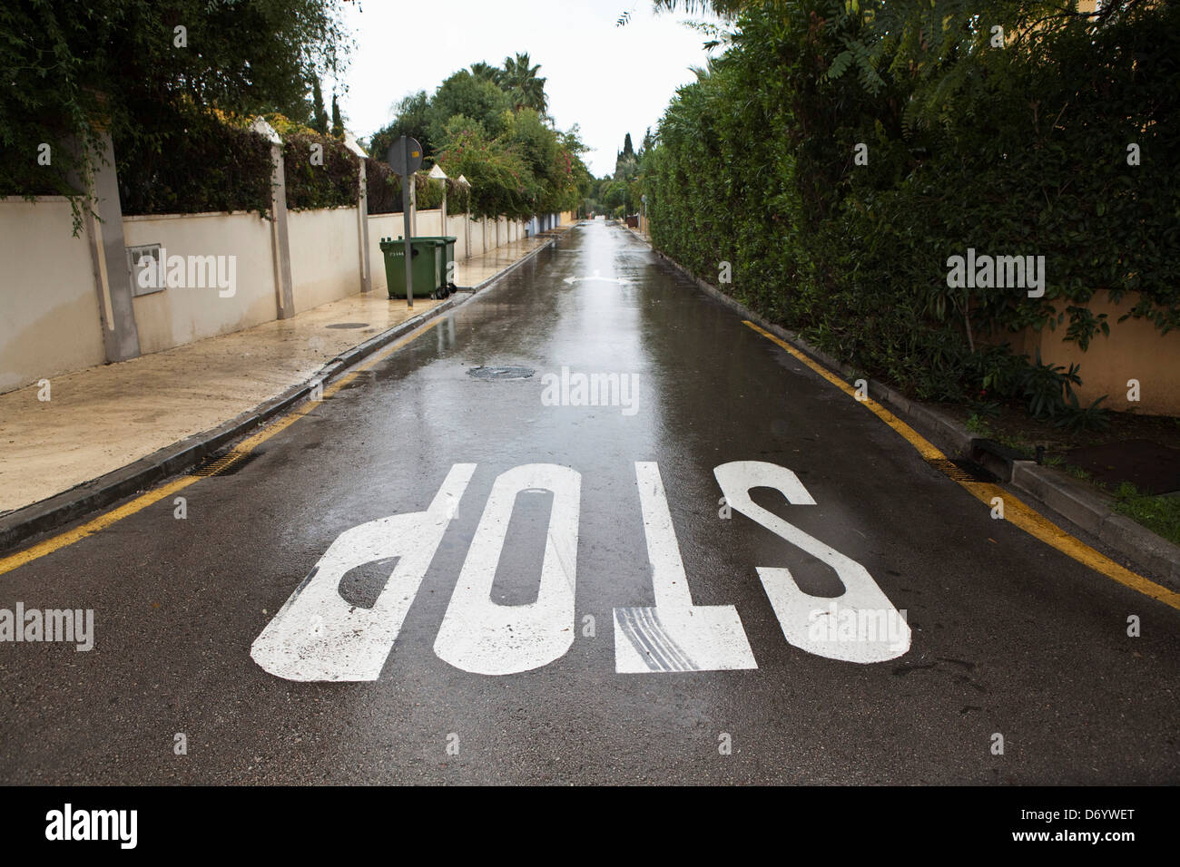 Street stop sign on the pavement in Majorca, Spain Stock Photo - Alamy