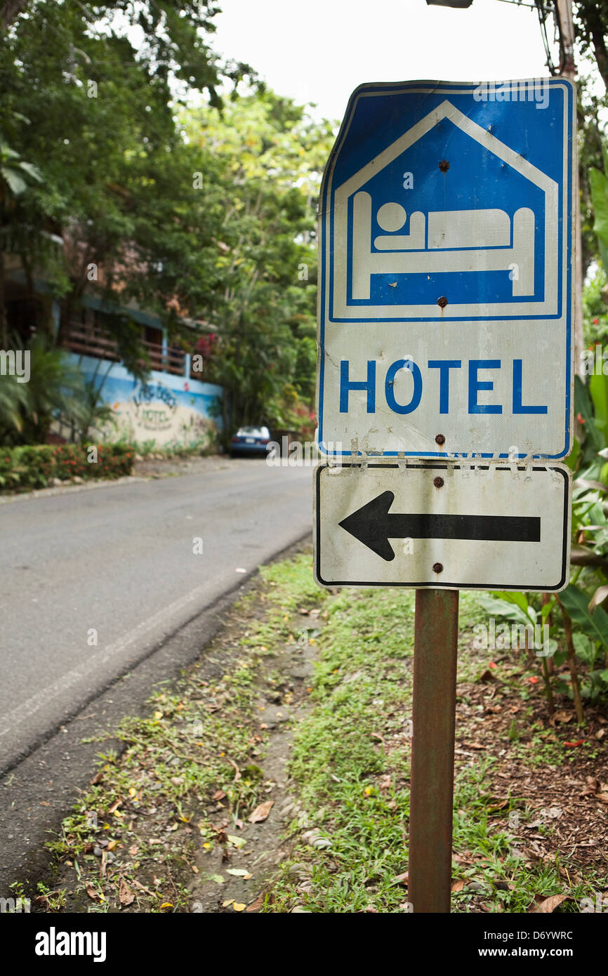 Hotel sign showing vehicles where to stop, Costa Rica Stock Photo - Alamy
