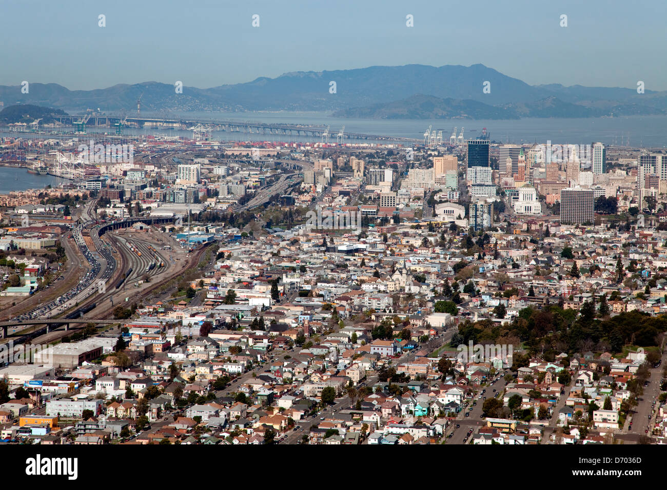 Aerial of Oakland, California with the Downtown Skyline and mountains ...