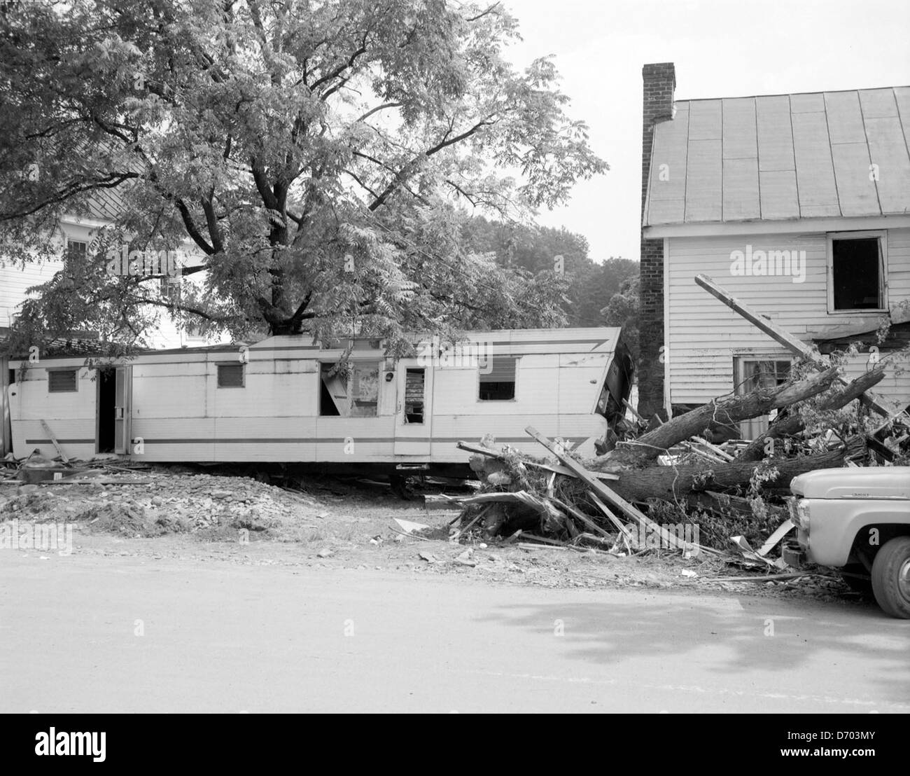 This photograph shows the aftermath of flooding along Route 56 in ...